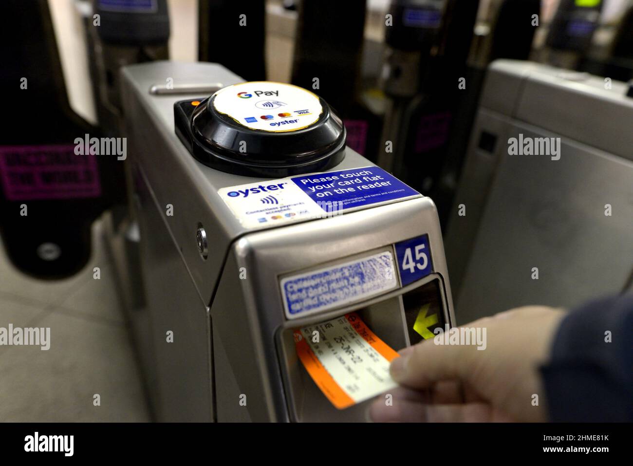 London, England, UK. Putting a One Day Travelcard into a London ...
