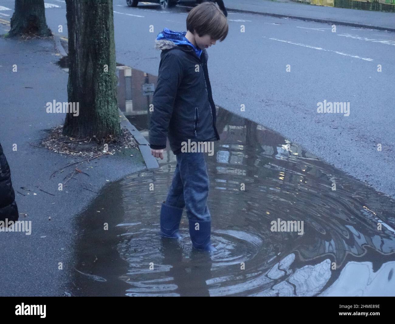 Playing in puddle hi-res stock photography and images - Alamy