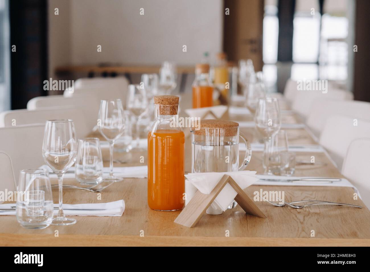 Empty dishes and cutlery on the table in the restaurant before dinner ...