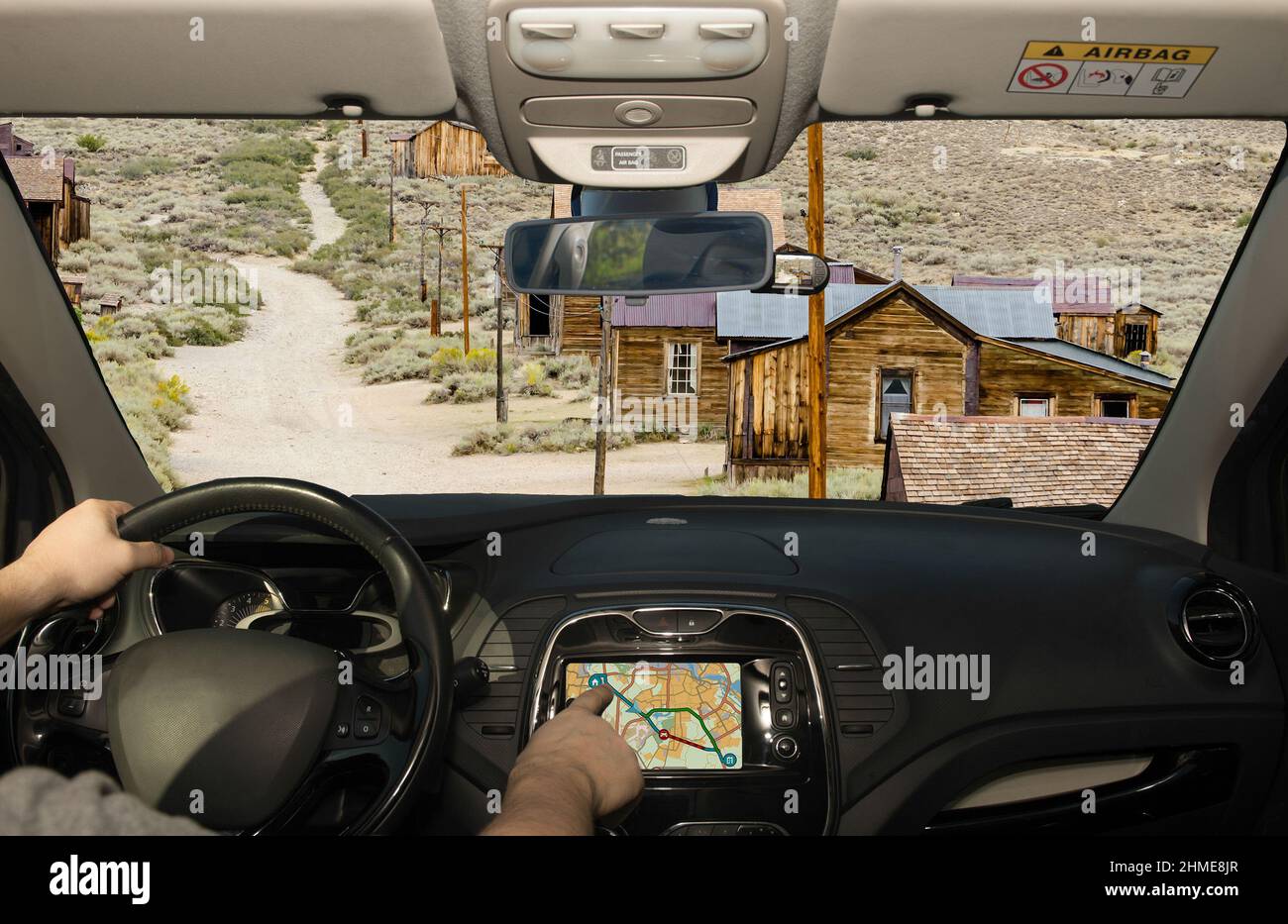 Driving a car while using the touch screen of a GPS navigation system ...