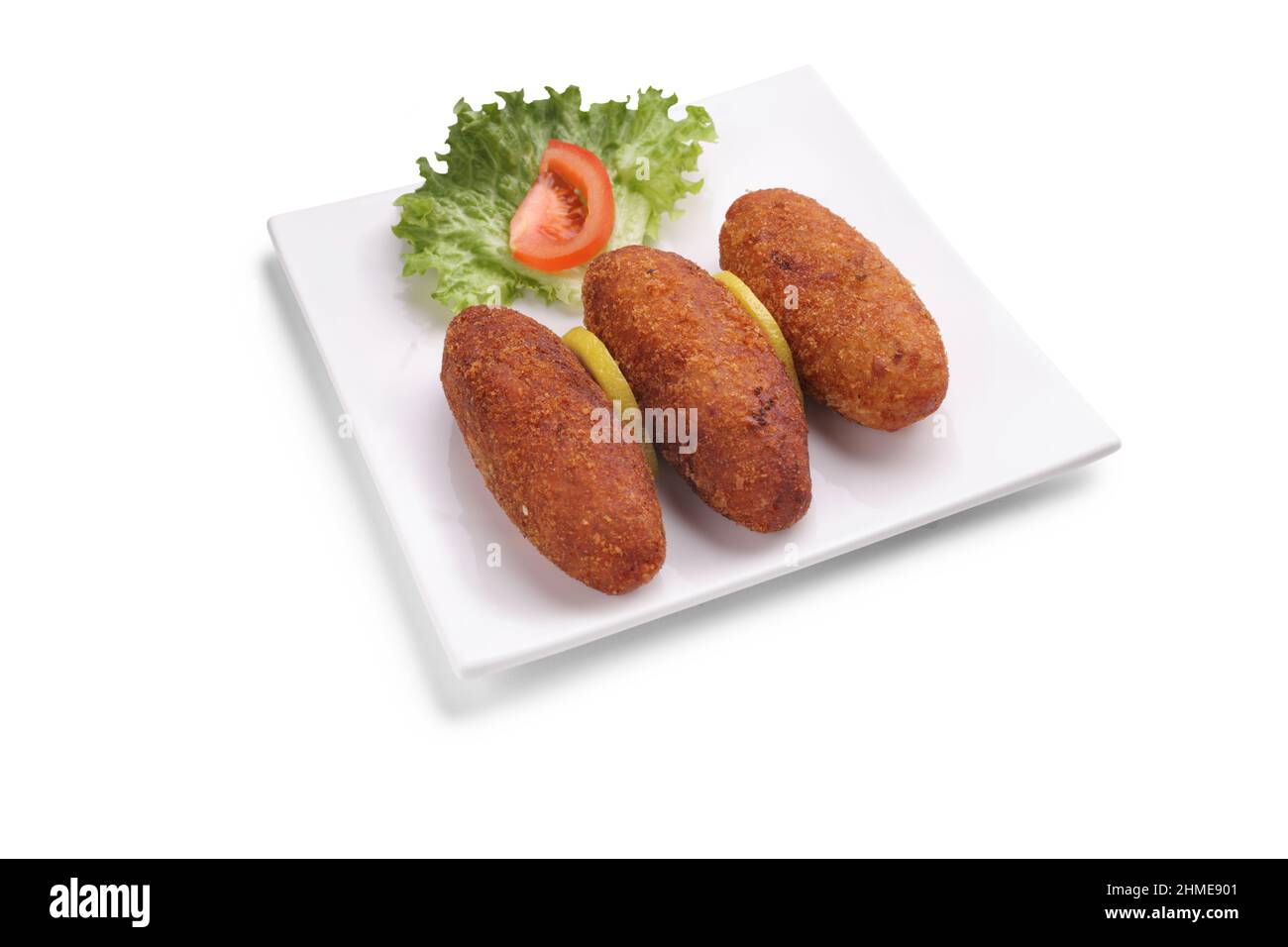 Three pieces of arabic kubba on a white plate isolated on white ...
