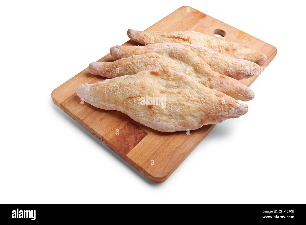 Traditional iraqi bread on a wooden tray isolated on white background ...
