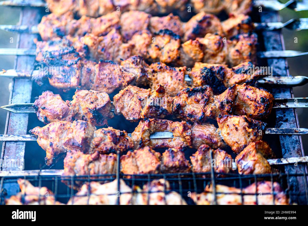 Marinated shish kebab is cooked on a charcoal grill. meat on roast beef ...