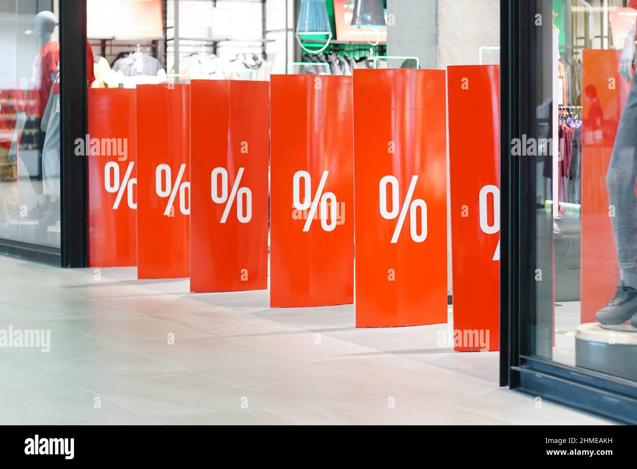 Enter of a clothing store with percent sign. Concept of shopping and ...