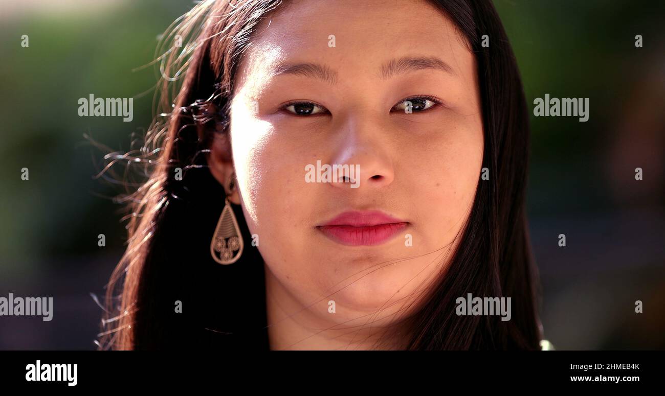 Asian young woman no expression portrait outside at park Stock Photo ...