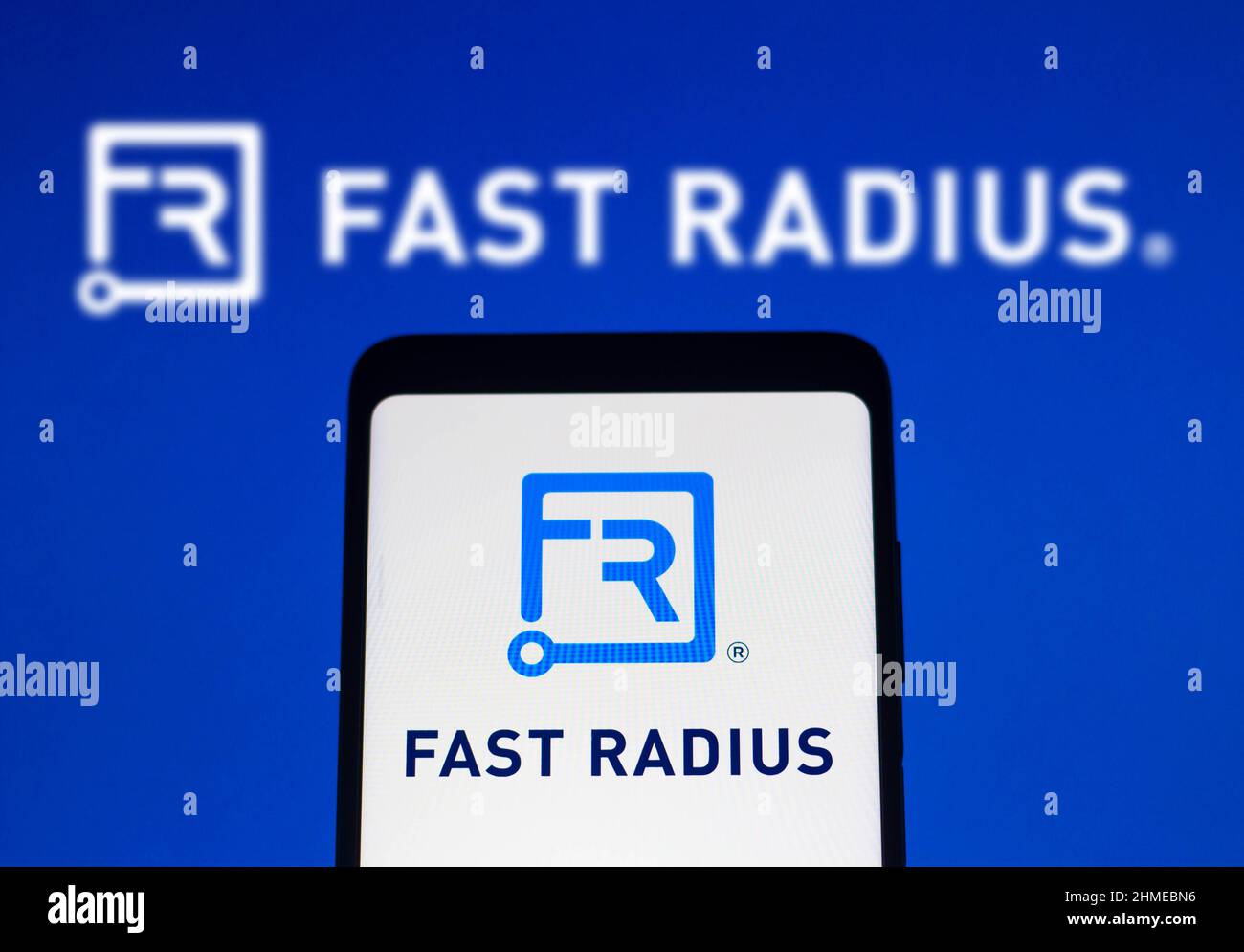 In this photo illustration the Fast Radius logo seen displayed on a ...