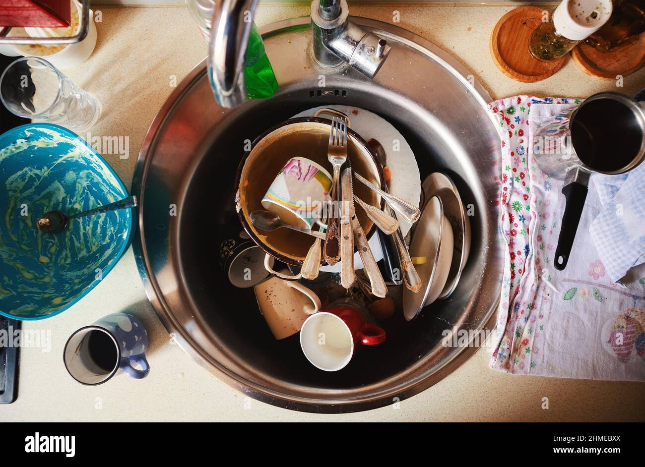 Details of dirty and used dishes in a sink, kitchen ordinary scene ...