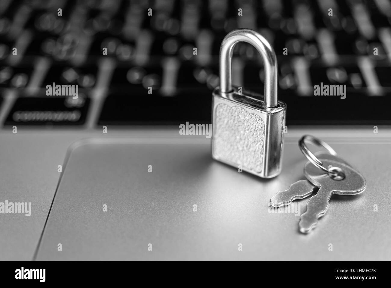 Computer security concept. Padlock on computer keyboard, laptop in office. Cyber security and ...