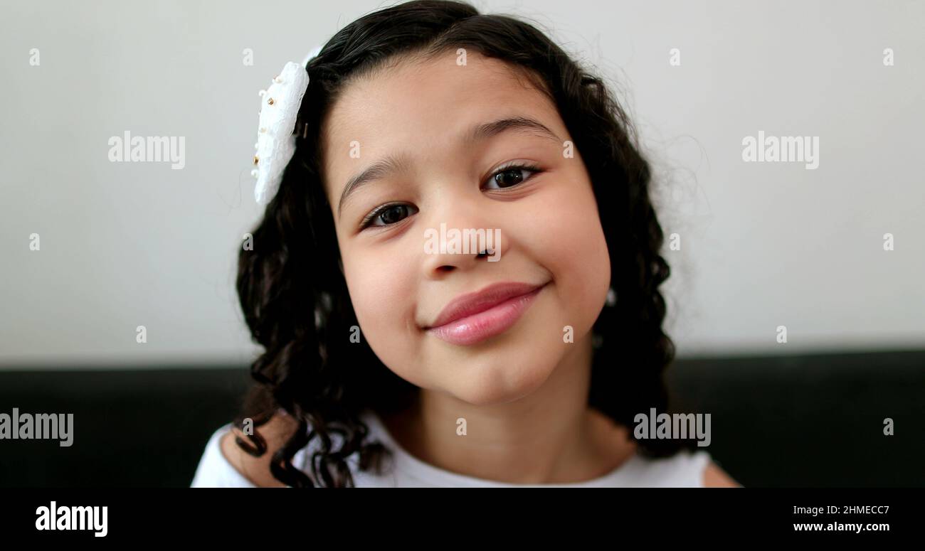 Happy joyful biracial little child girl smiling Stock Photo - Alamy