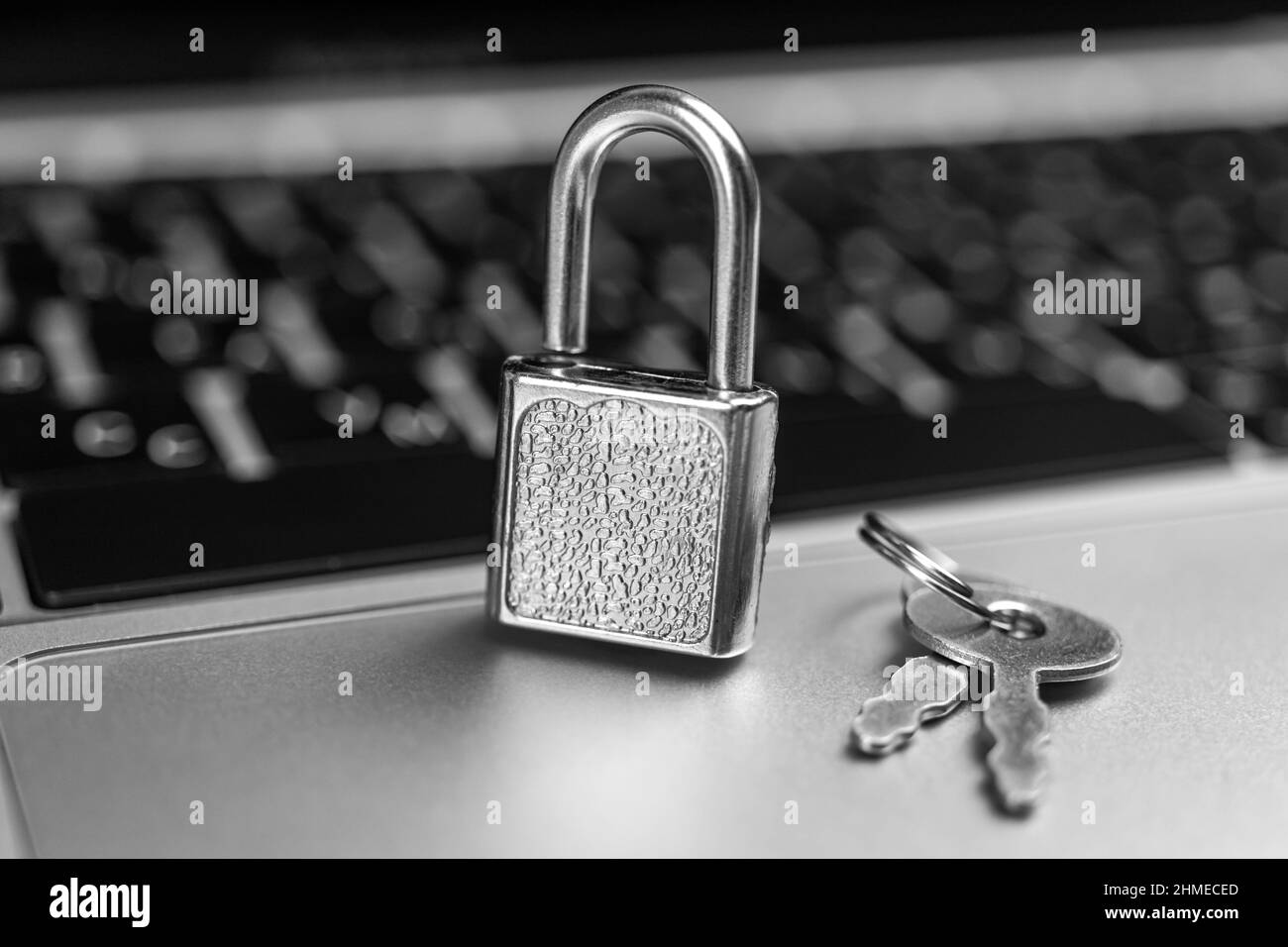 Computer security concept. Padlock on computer keyboard, laptop in ...
