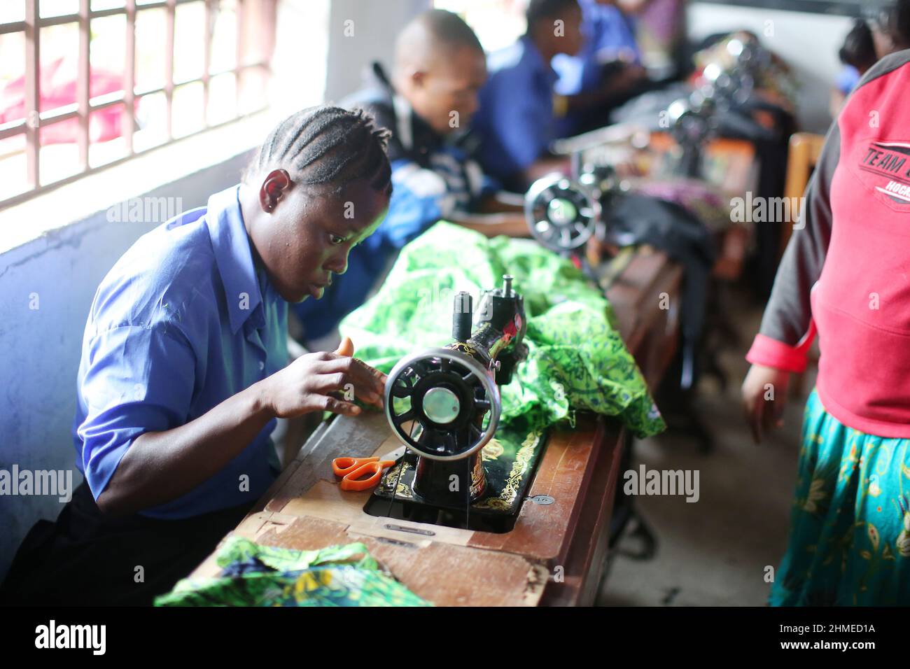 School children and young adults learn trades at an NGO funded ...