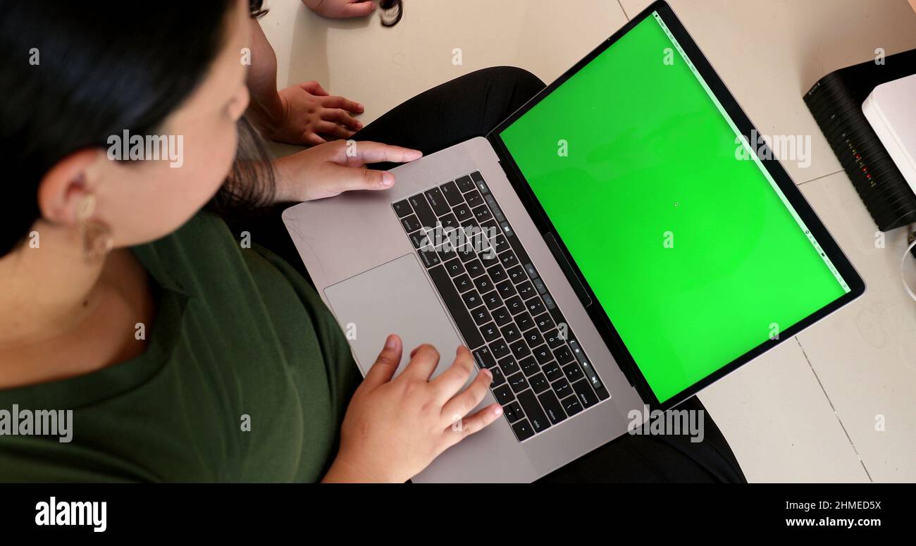 Person using computer laptop, blank green screen mock-up Stock Photo ...