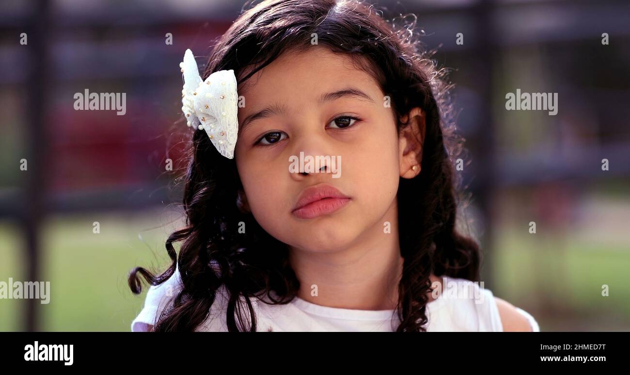 Portrait small child, close-up little girl face looking at camera ...