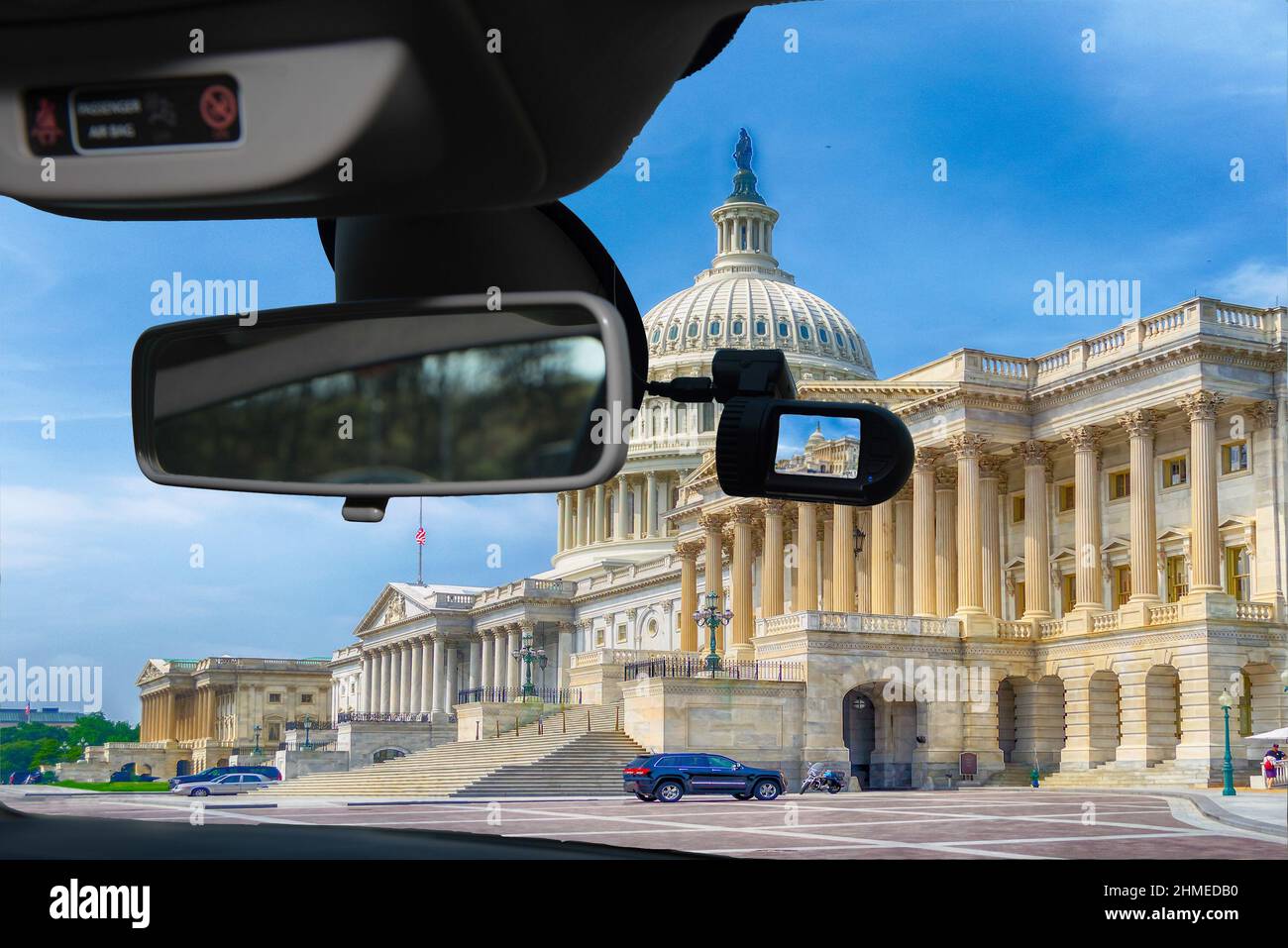 Looking through a dashcam car camera installed on a windshield with ...