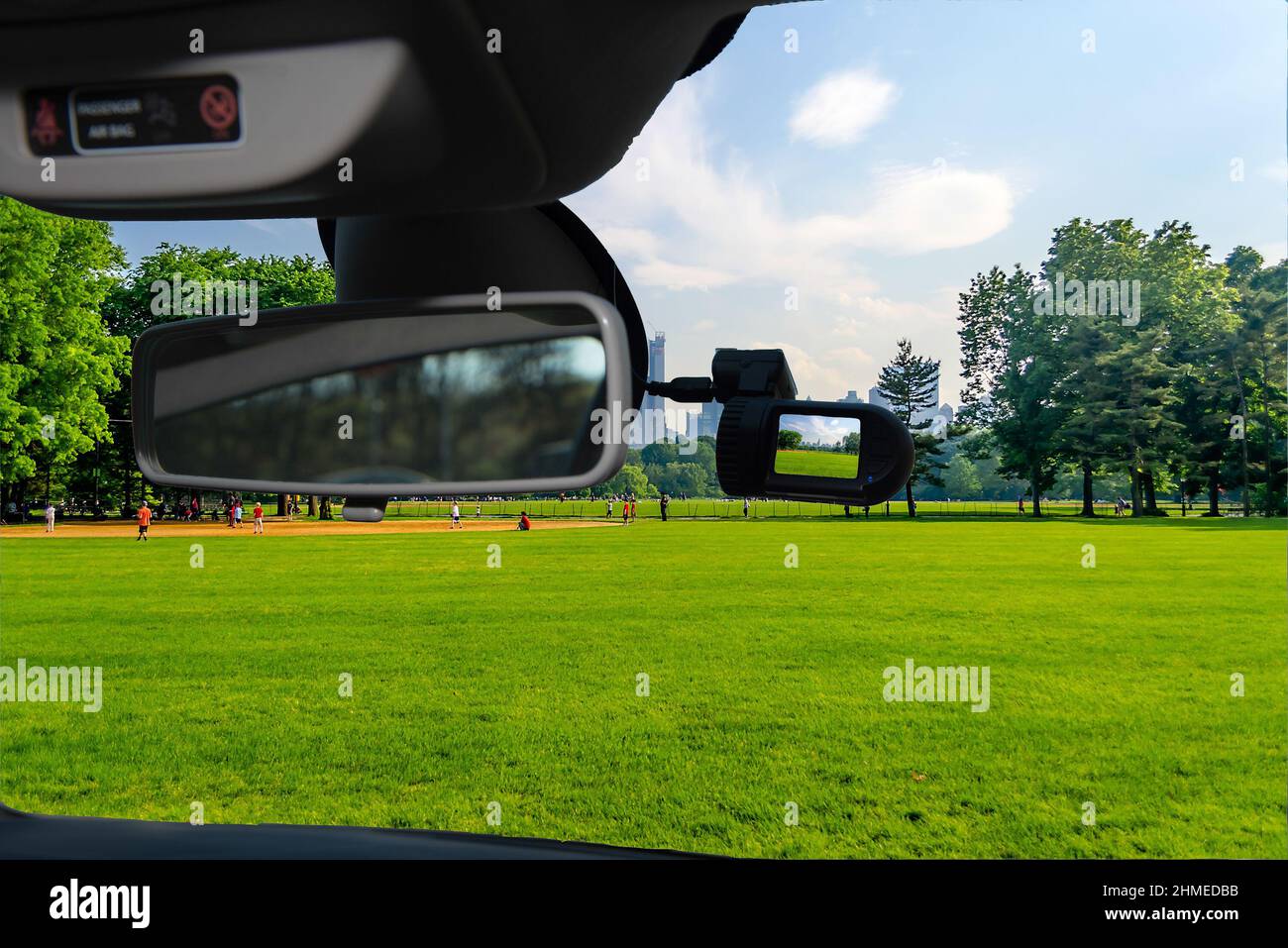 Looking through a dashcam car camera installed on a windshield with ...