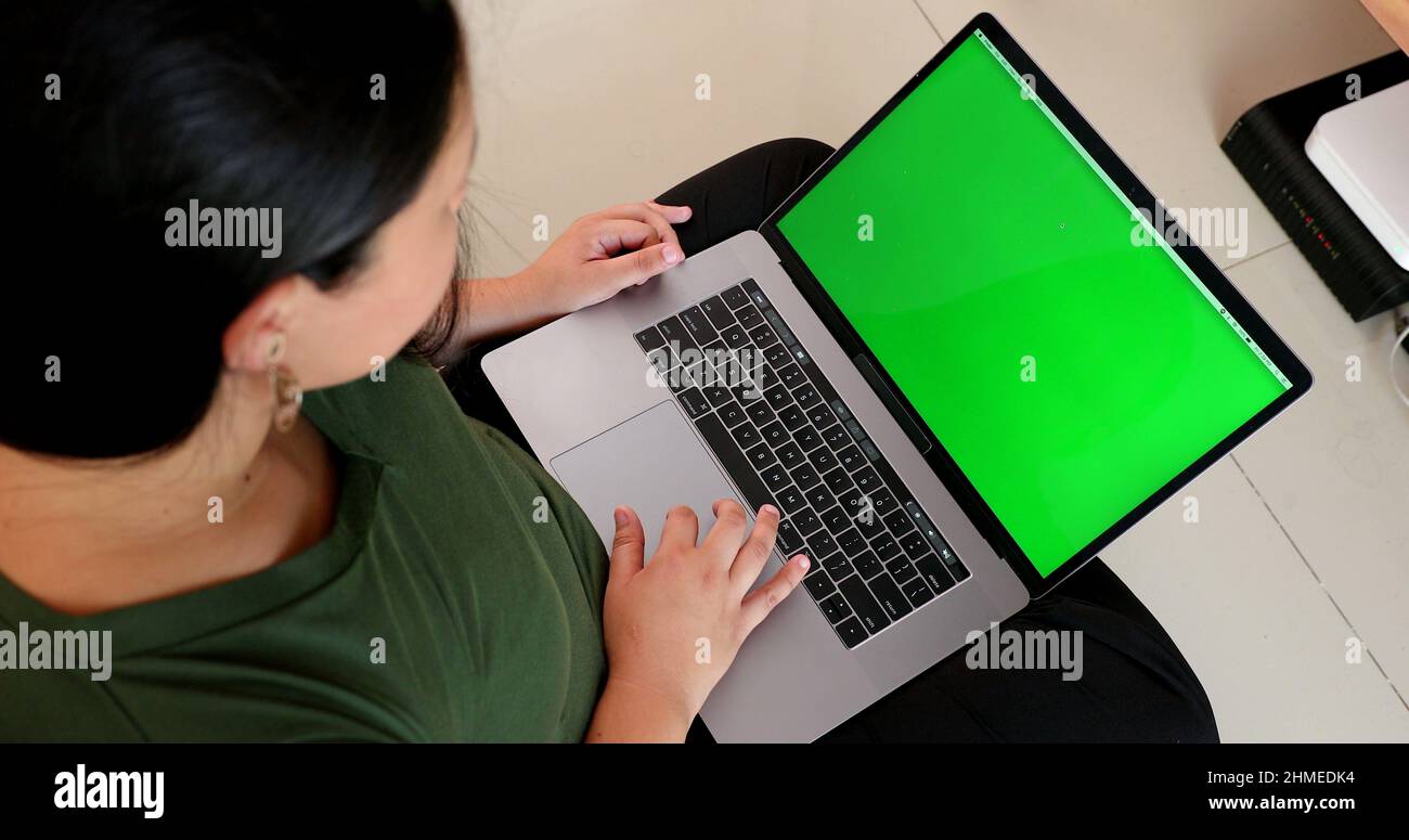Woman using laptop computer, green screen mockup Stock Photo - Alamy