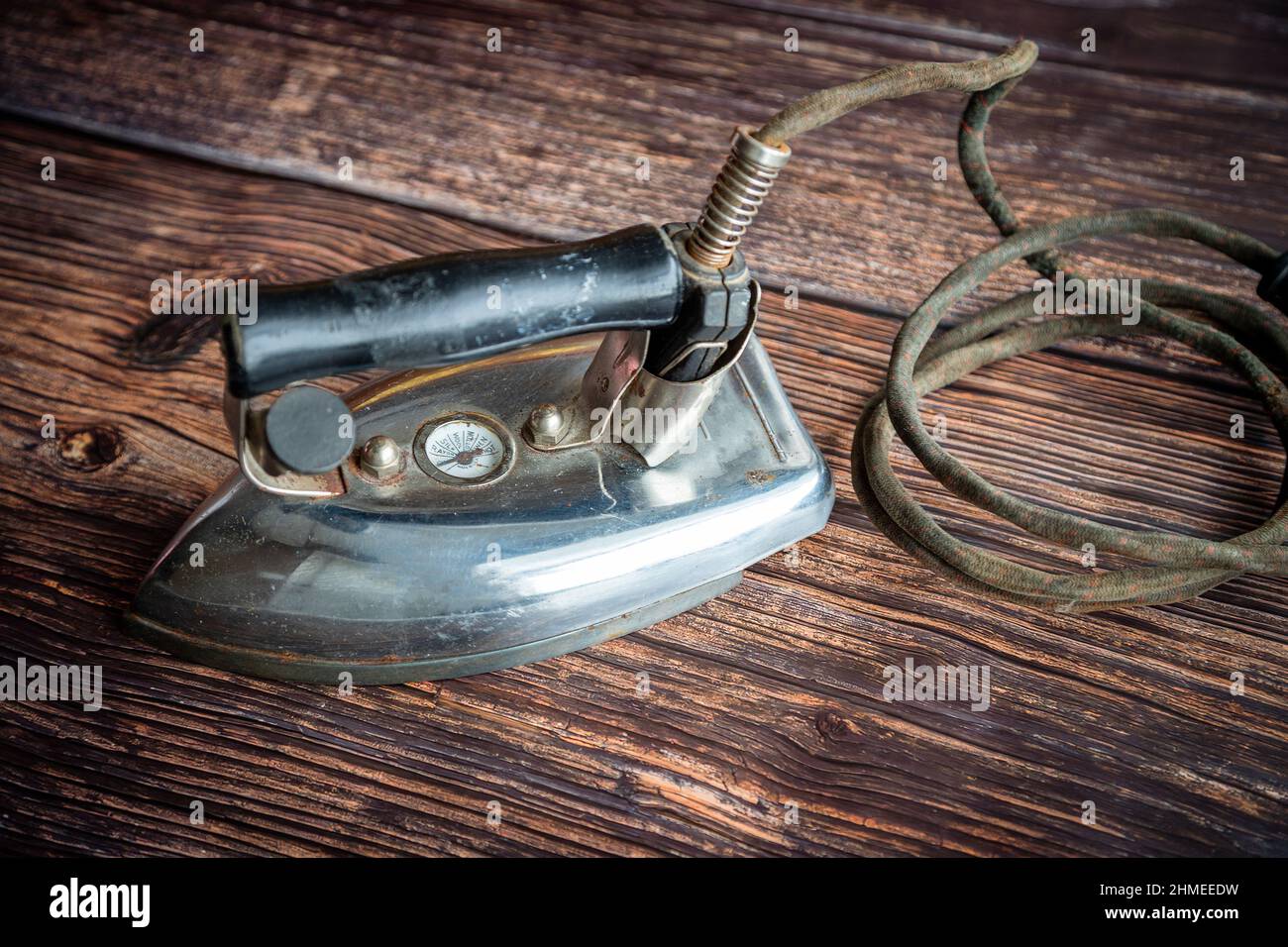 Vintage old-fashioned electric iron for clothes with wooden handle and ...