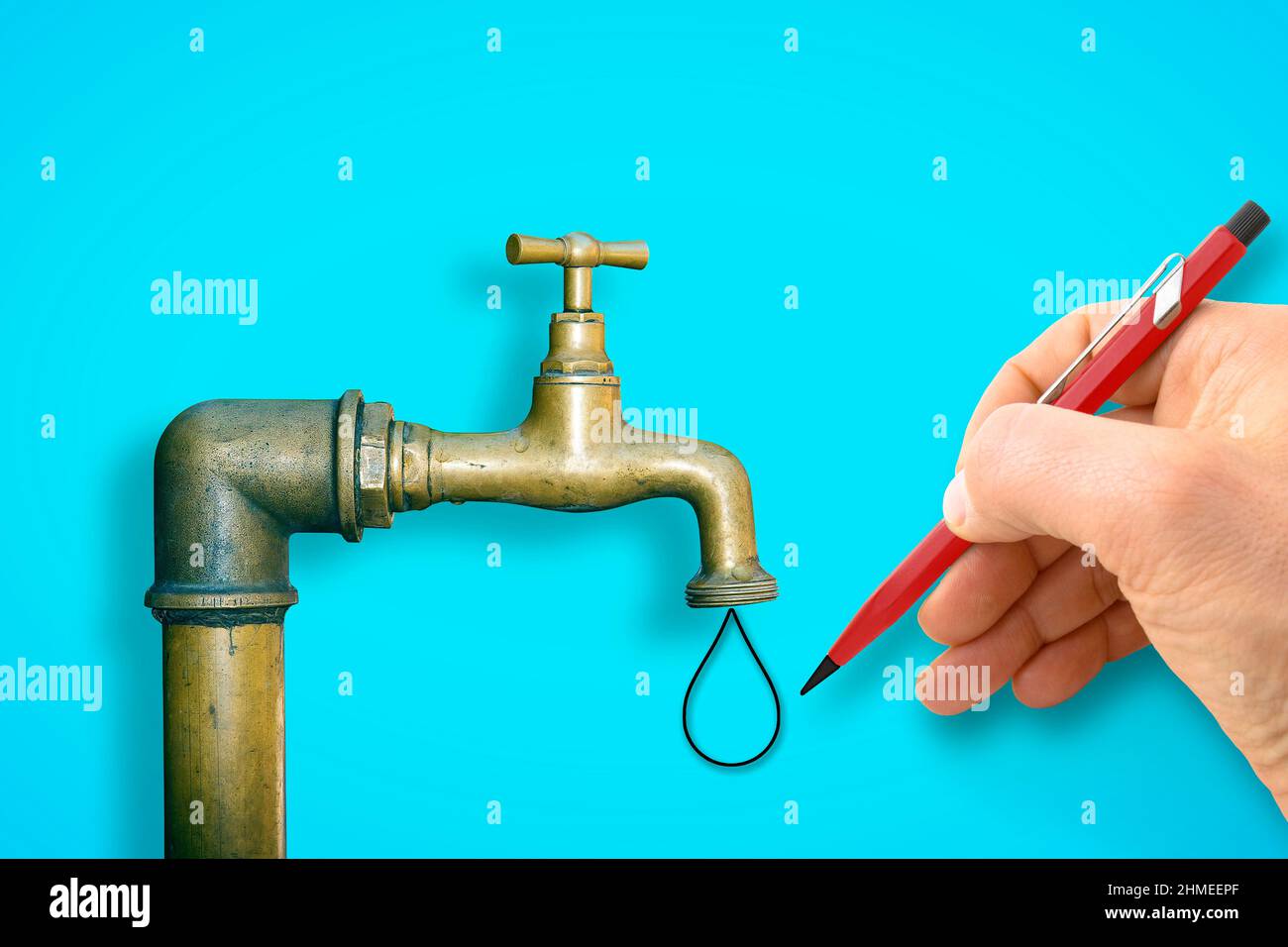 Human hand draws a drop of water against a water brass faucet isolated ...