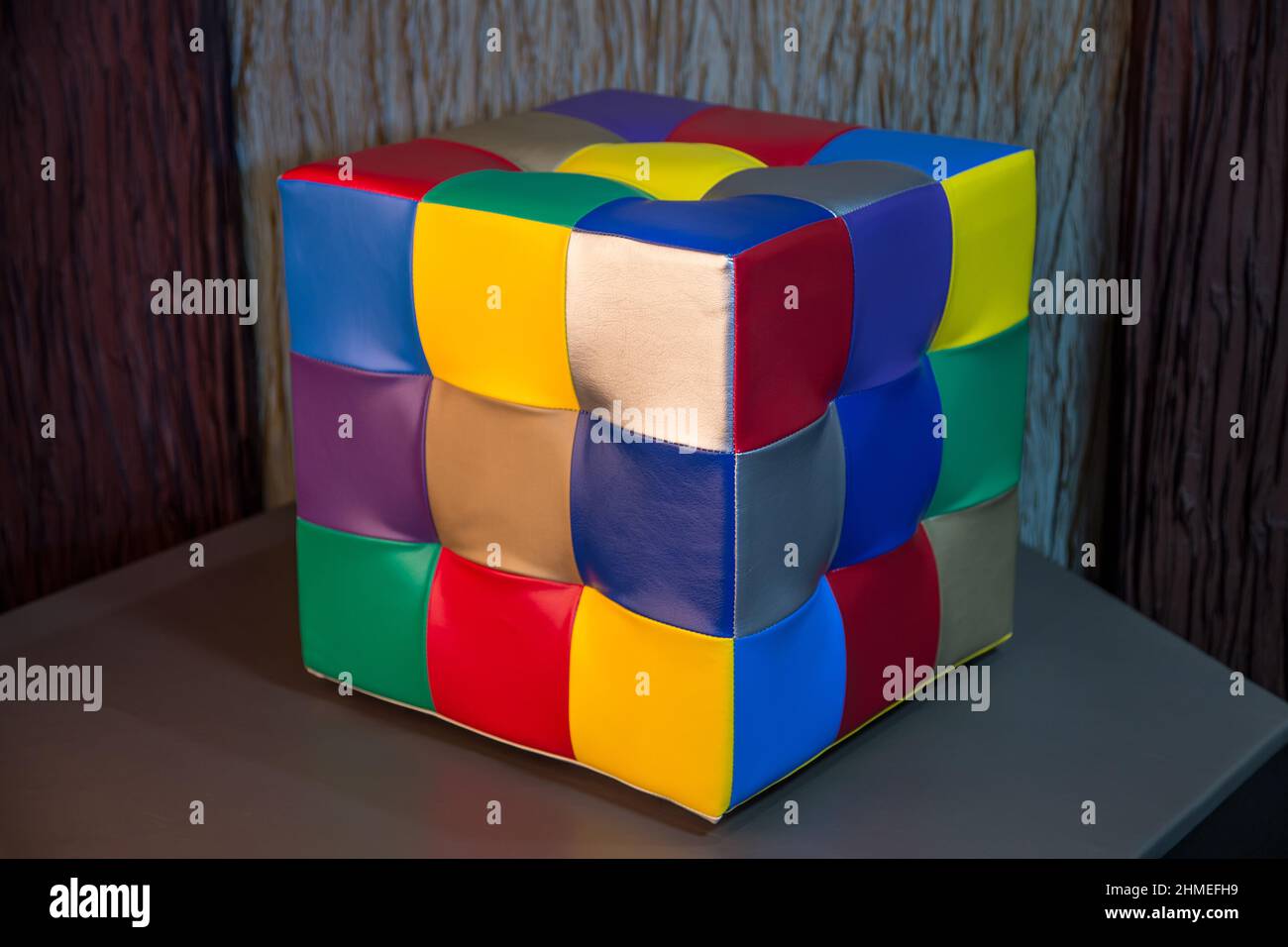 Rubik's cube chair with multicoloured leather squares Stock Photo - Alamy
