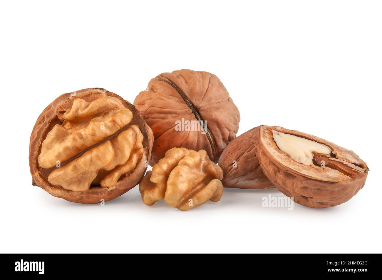 fresh kernels, broken and whole walnuts close-up isolated on white ...