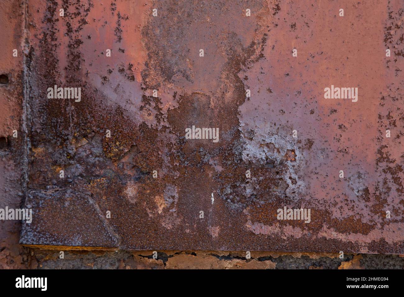 Old rusty metal plate with holes as a background Stock Photo - Alamy