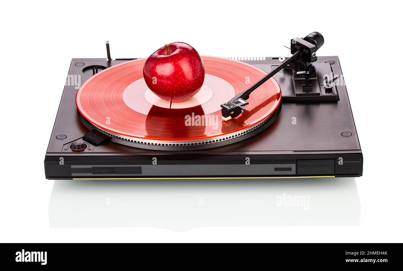 old fashioned turntable playing a track from black vinyl with an apple ...