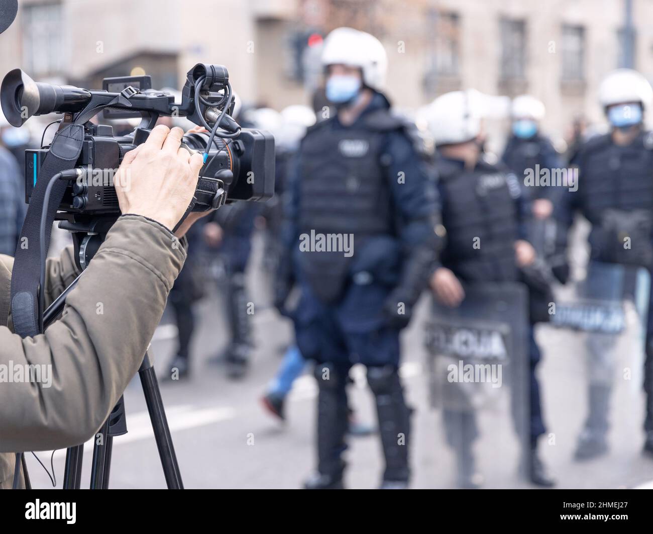 Filming riot police during crowd demonstration against COVID-19 ...