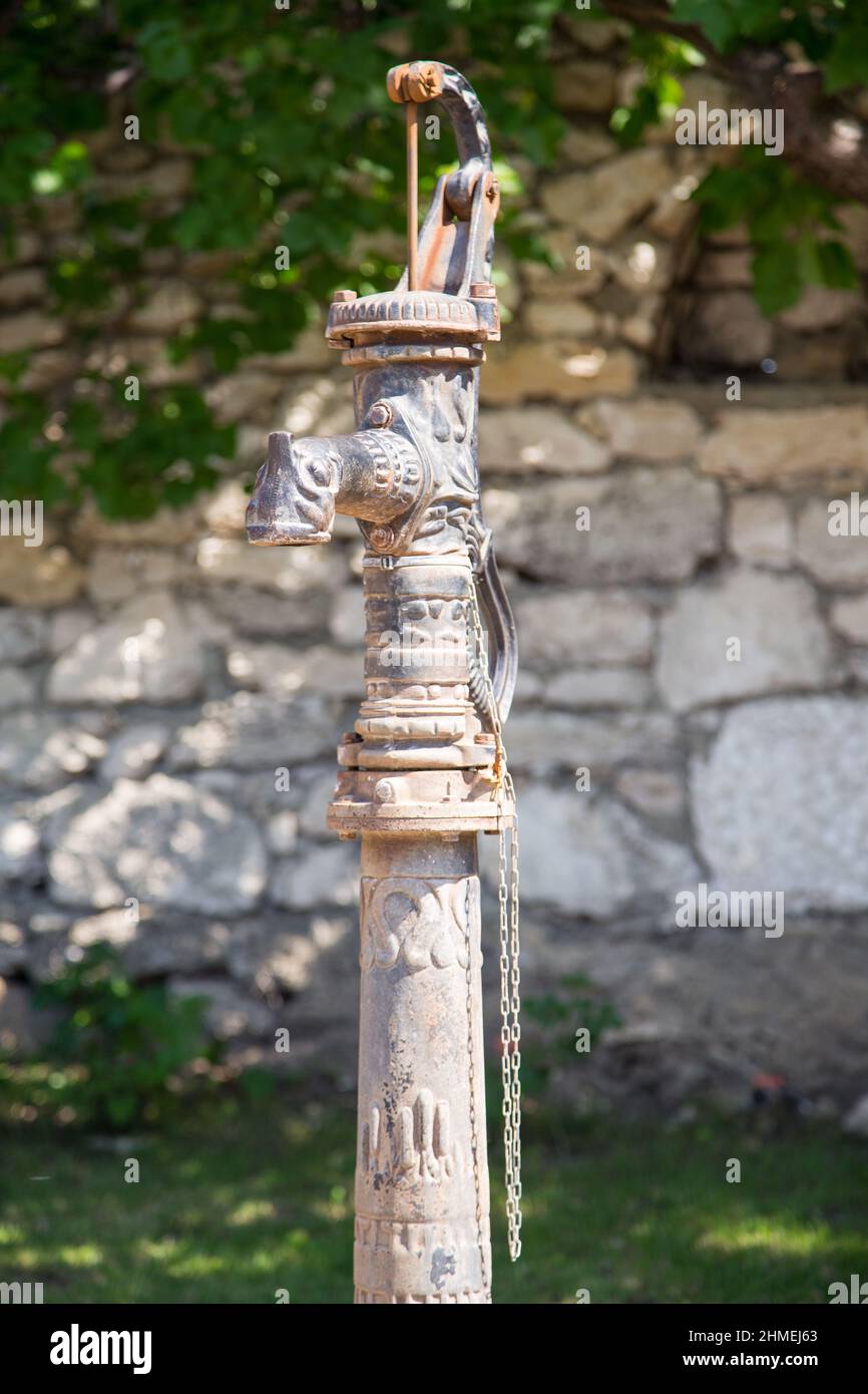 old rusted water pump outside in the park Stock Photo - Alamy