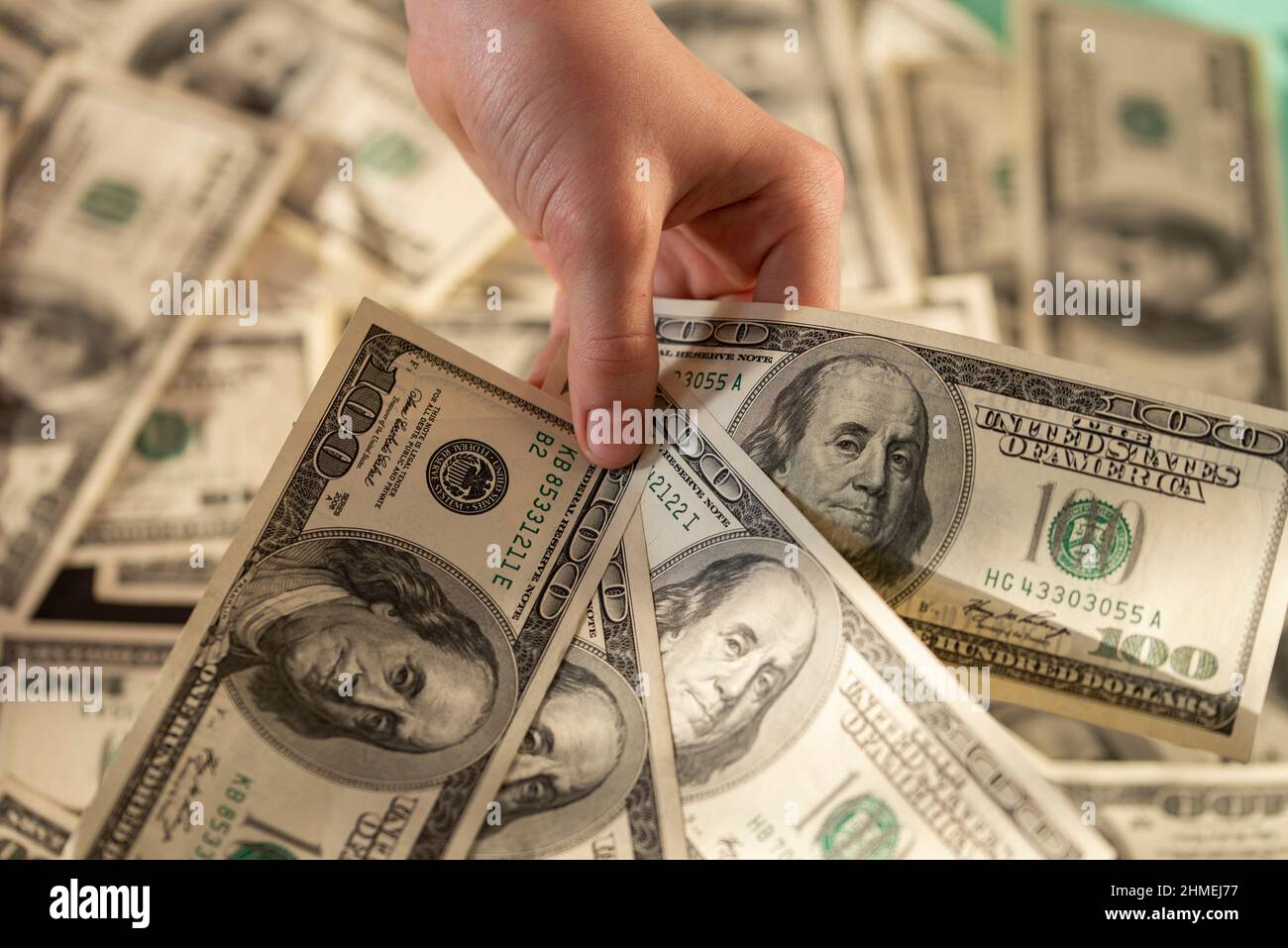 Child holding dollar bills hi-res stock photography and images - Alamy