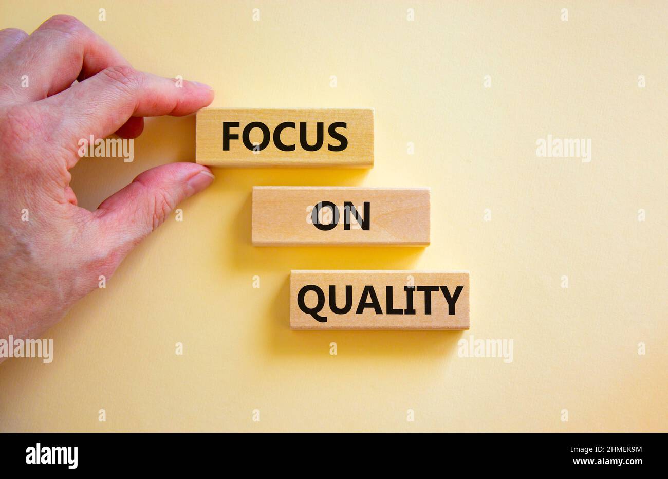 Focus on quality symbol. Concept words Focus on quality on blocks on ...