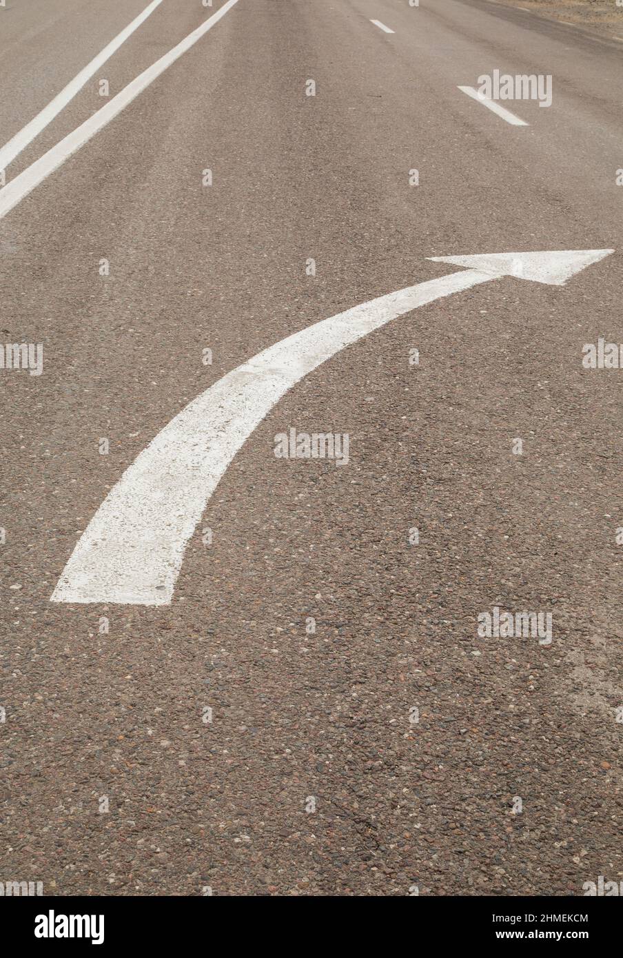 White arrow marking on road. Traffic sign Stock Photo - Alamy