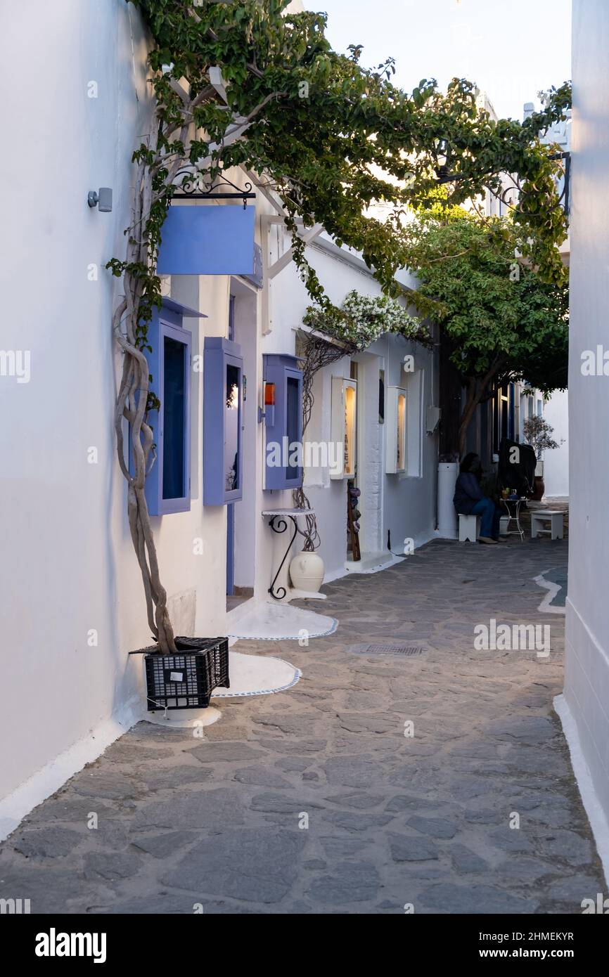 Greece, Milos island. Traditional open souvenir shop, shadow of ...