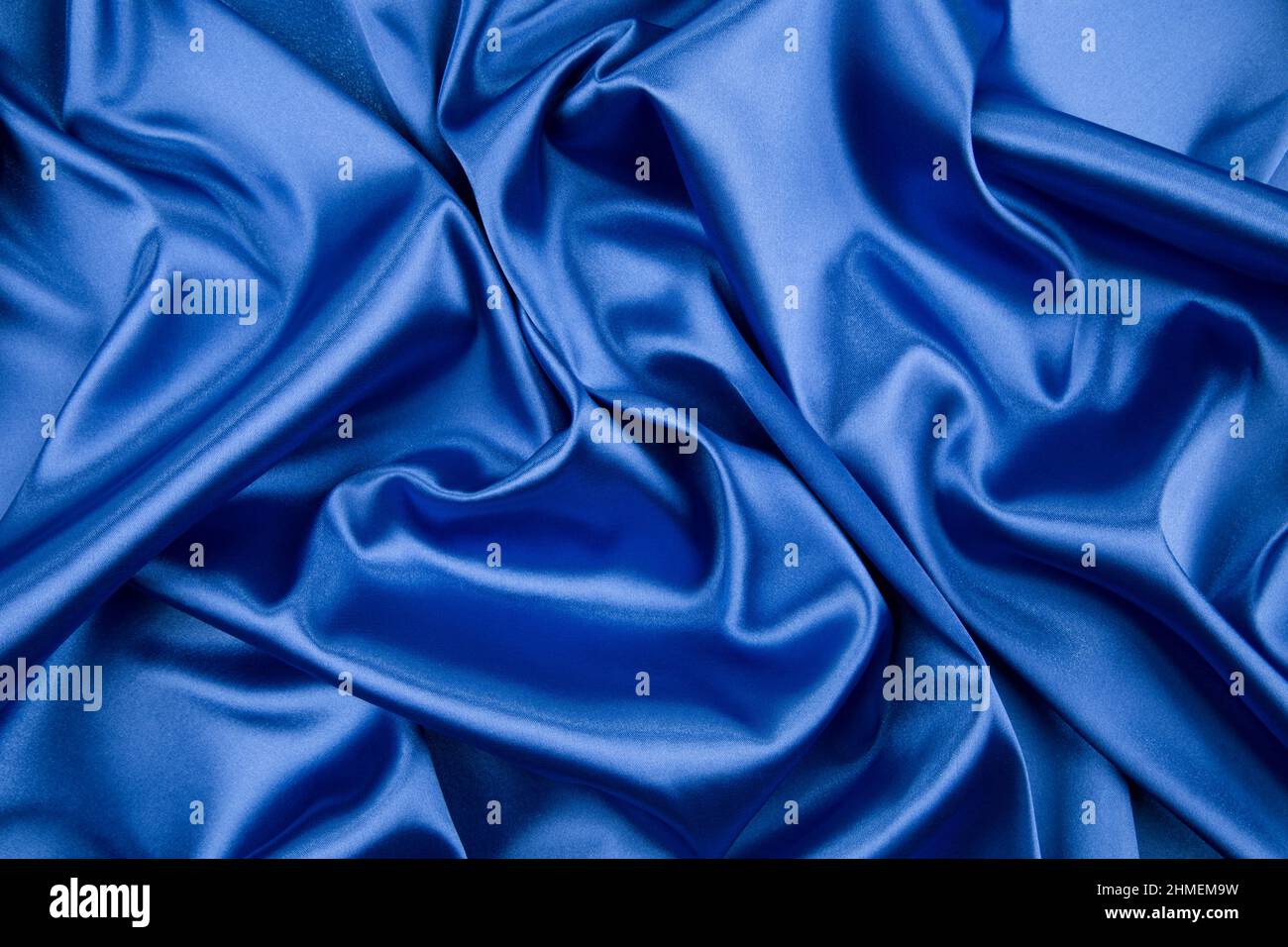 Blue drapery silk fabric. Located on a whole background Stock Photo - Alamy