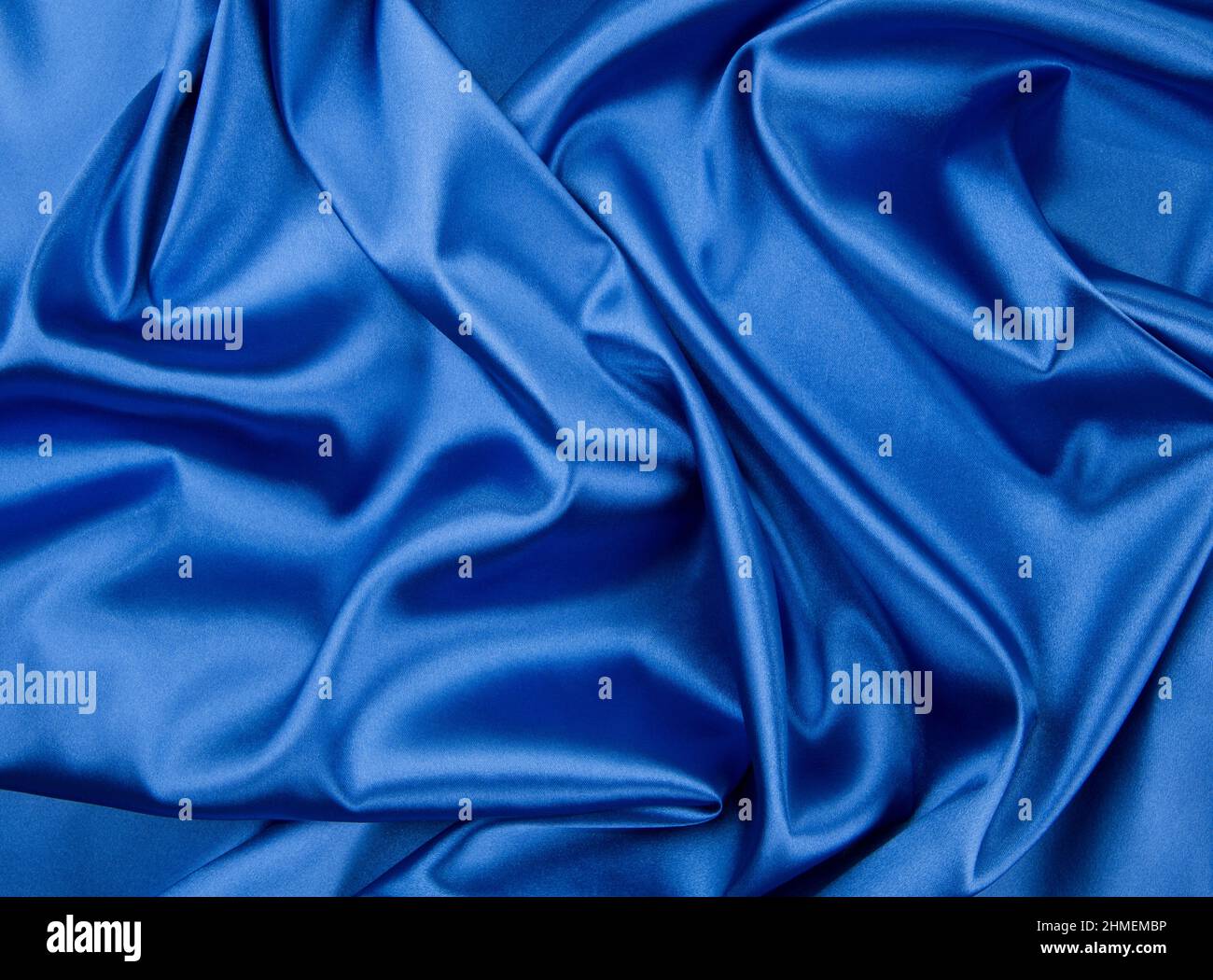 Blue drapery silk fabric. Located on a whole background Stock Photo - Alamy