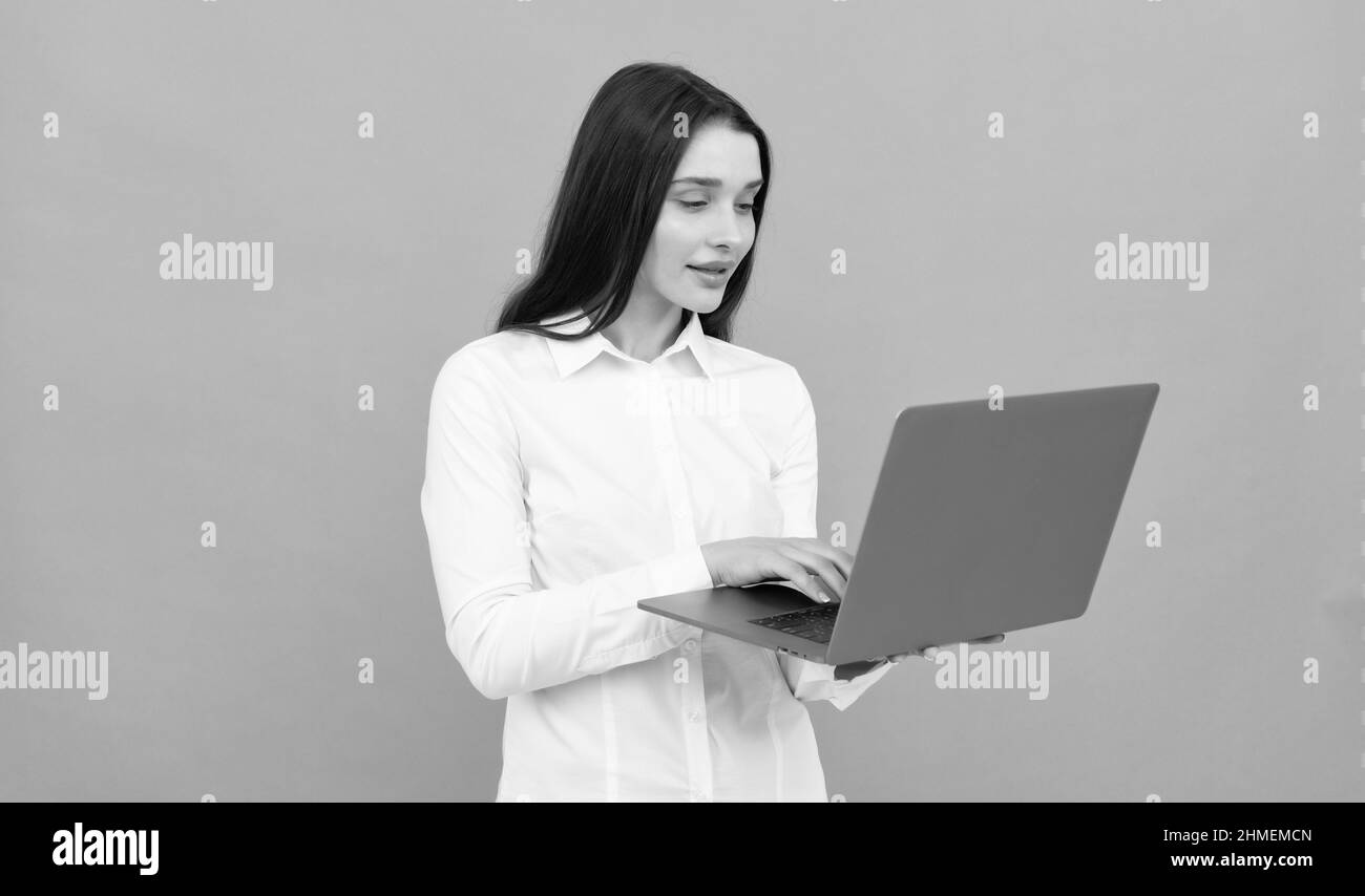 agile business. confident woman working online. modern wireless laptop ...