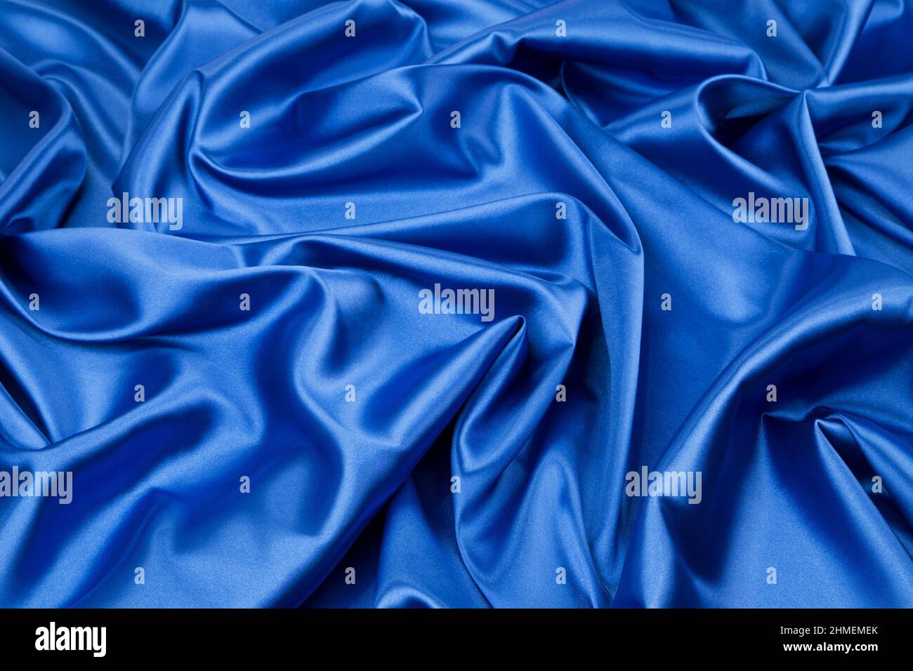 Blue drapery silk fabric. Located on a whole background Stock Photo - Alamy
