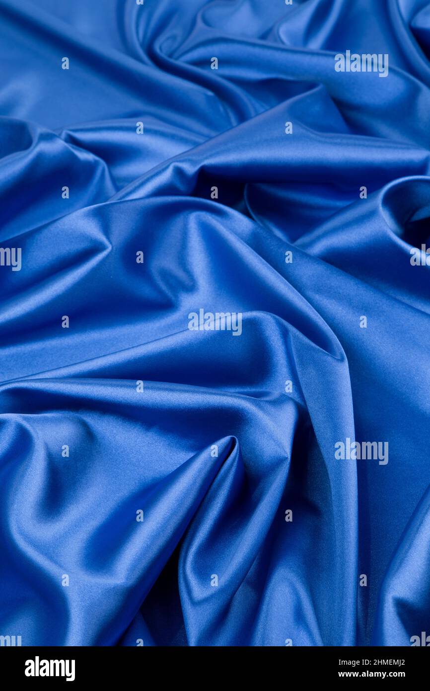 Blue drapery silk fabric. Located on a whole background Stock Photo - Alamy