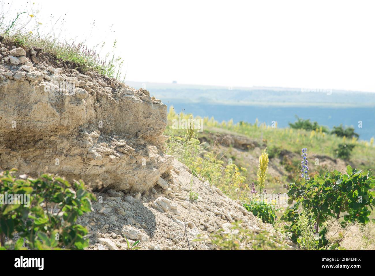 Rock and grass at background the sky Stock Photo - Alamy