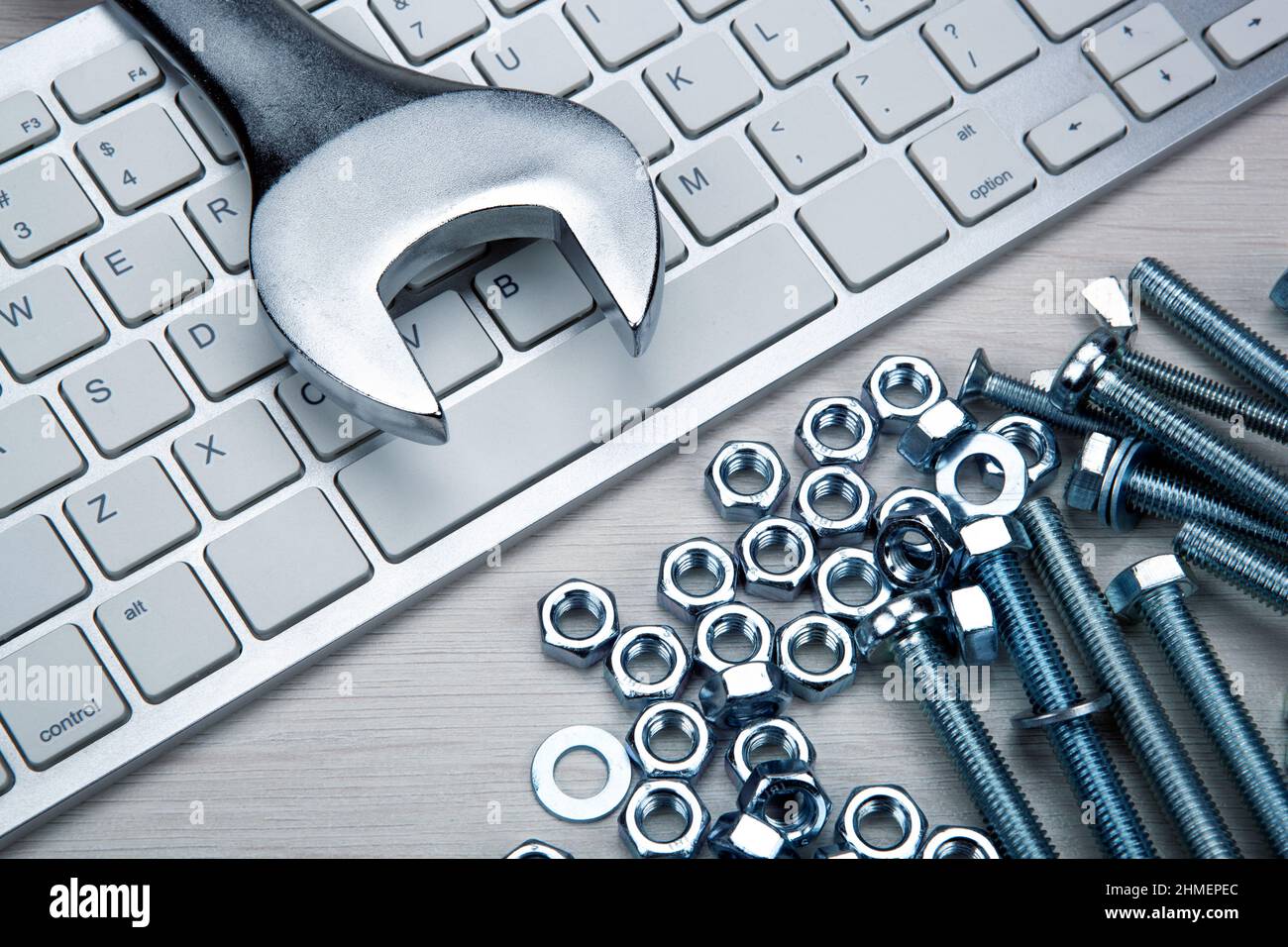 screws fastening materials and pc keyboard and a wrench closeup Stock ...