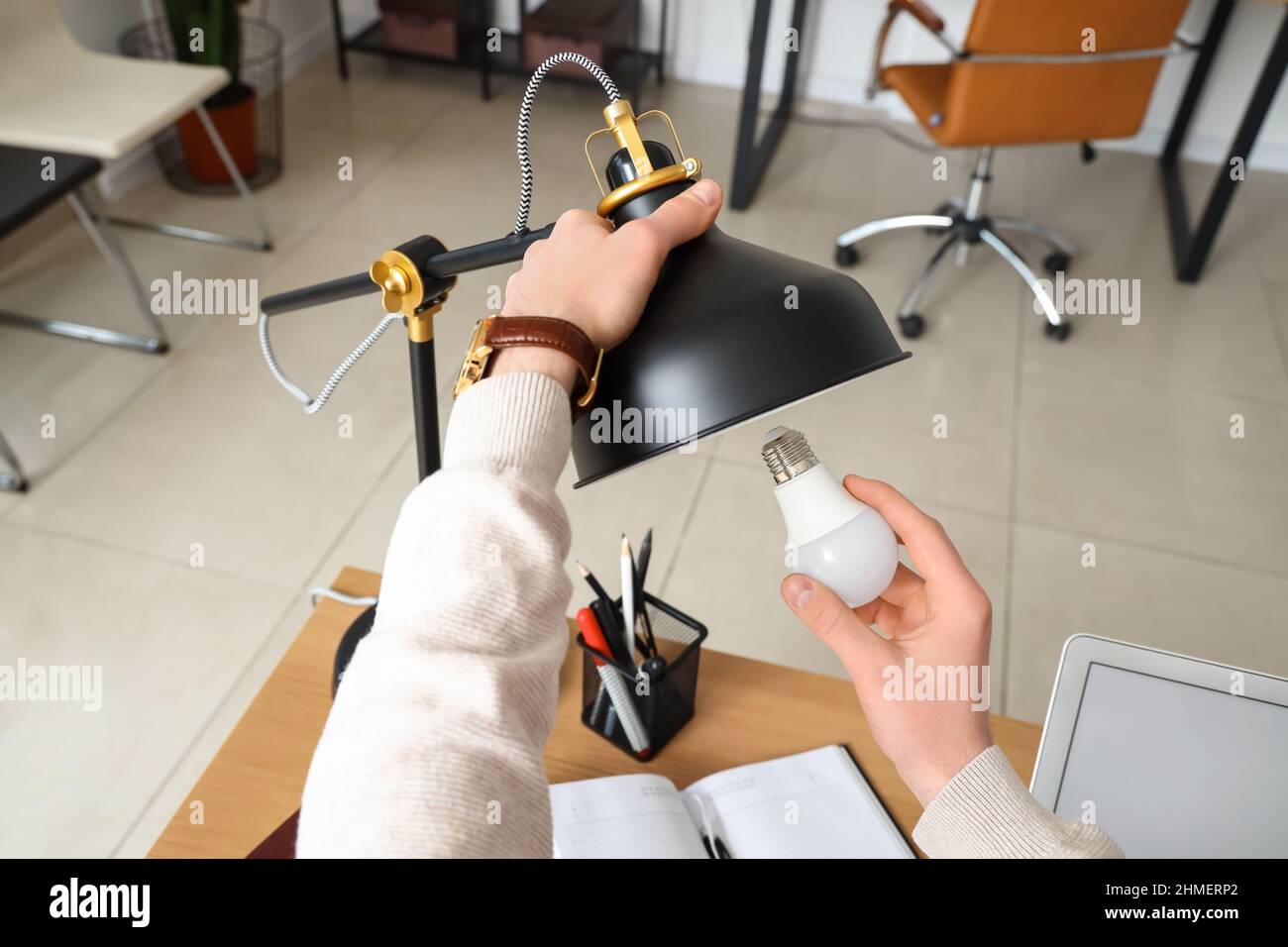 Male hands changing light hi-res stock photography and images - Alamy