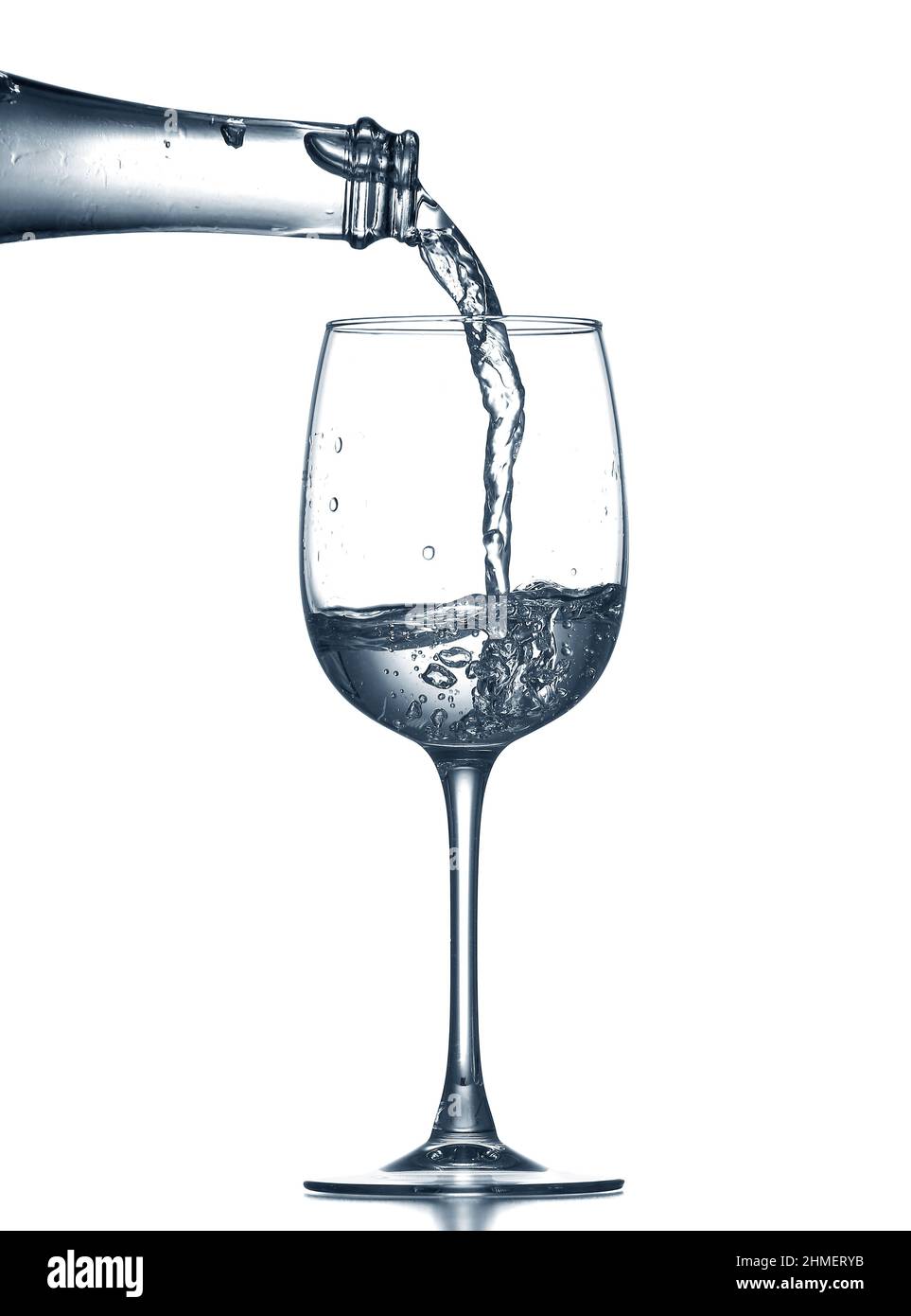 Pouring of clear water in glass isolated on white Stock Photo - Alamy
