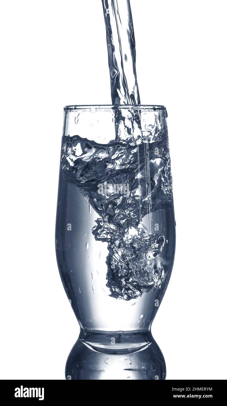 Pouring of clear water in glass isolated on white Stock Photo - Alamy