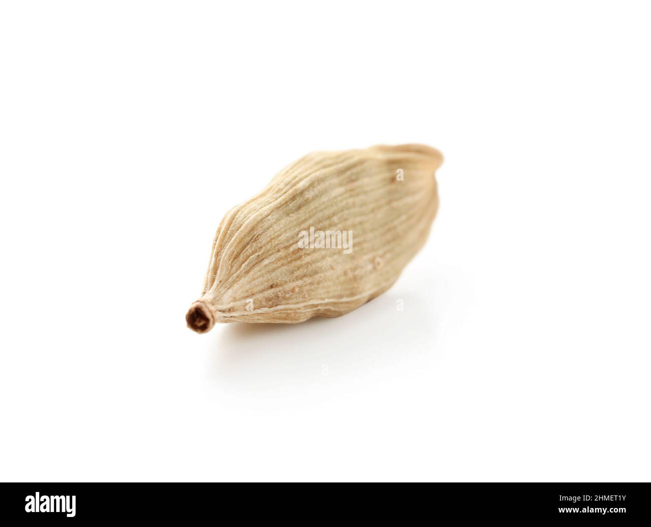 Cardamom seed isolated on white Stock Photo - Alamy