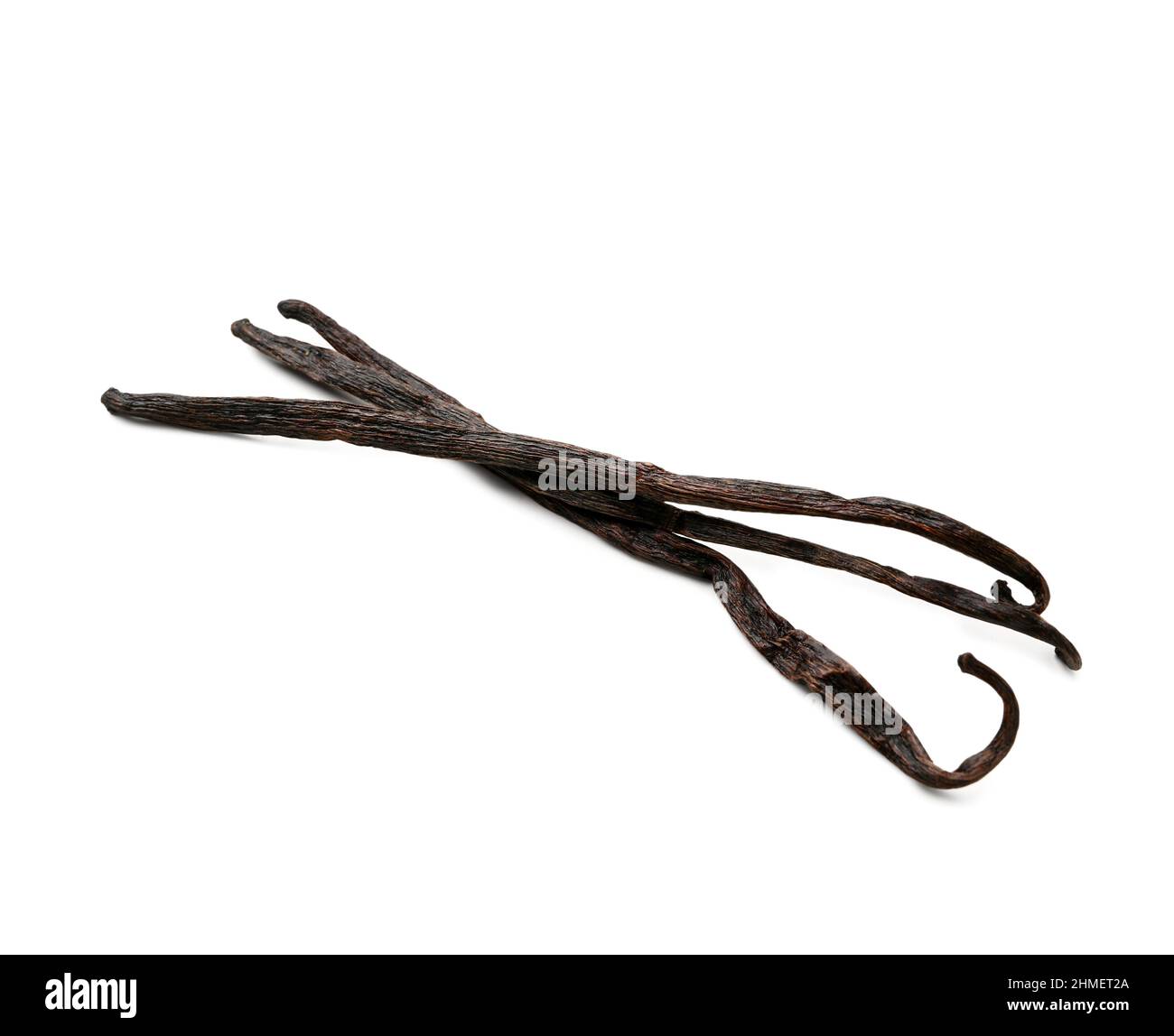 Dried vanilla pods isolated on white Stock Photo - Alamy