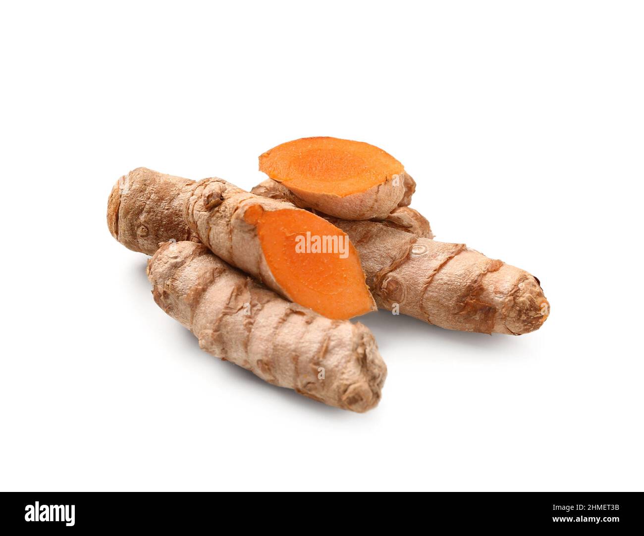 Turmeric roots isolated on white Stock Photo - Alamy