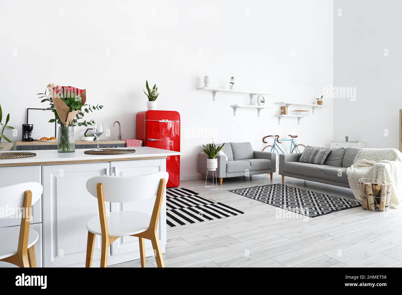 Interior of modern kitchen with counters, sofas and red fridge Stock ...