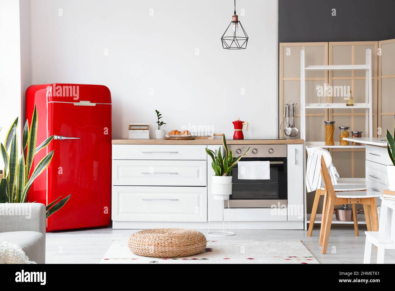 Interior of modern kitchen with red fridge and white counters Stock ...
