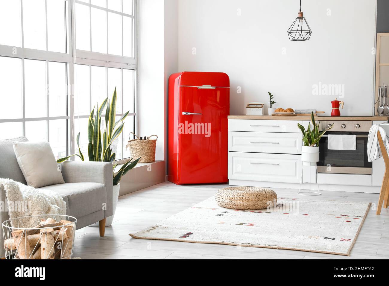 Interior of modern kitchen with red fridge and white counters Stock ...