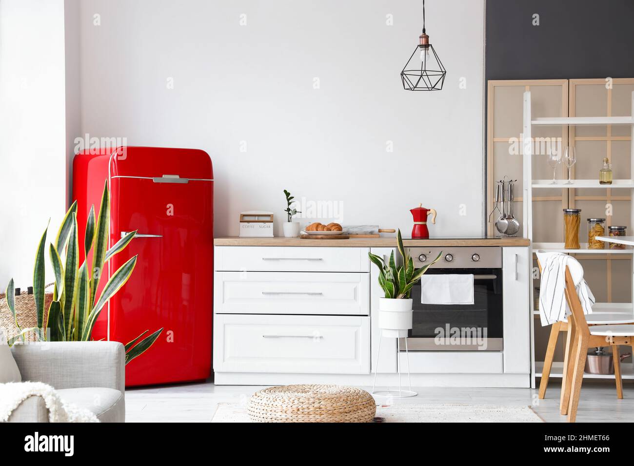 Interior of modern kitchen with red fridge and white counters Stock ...