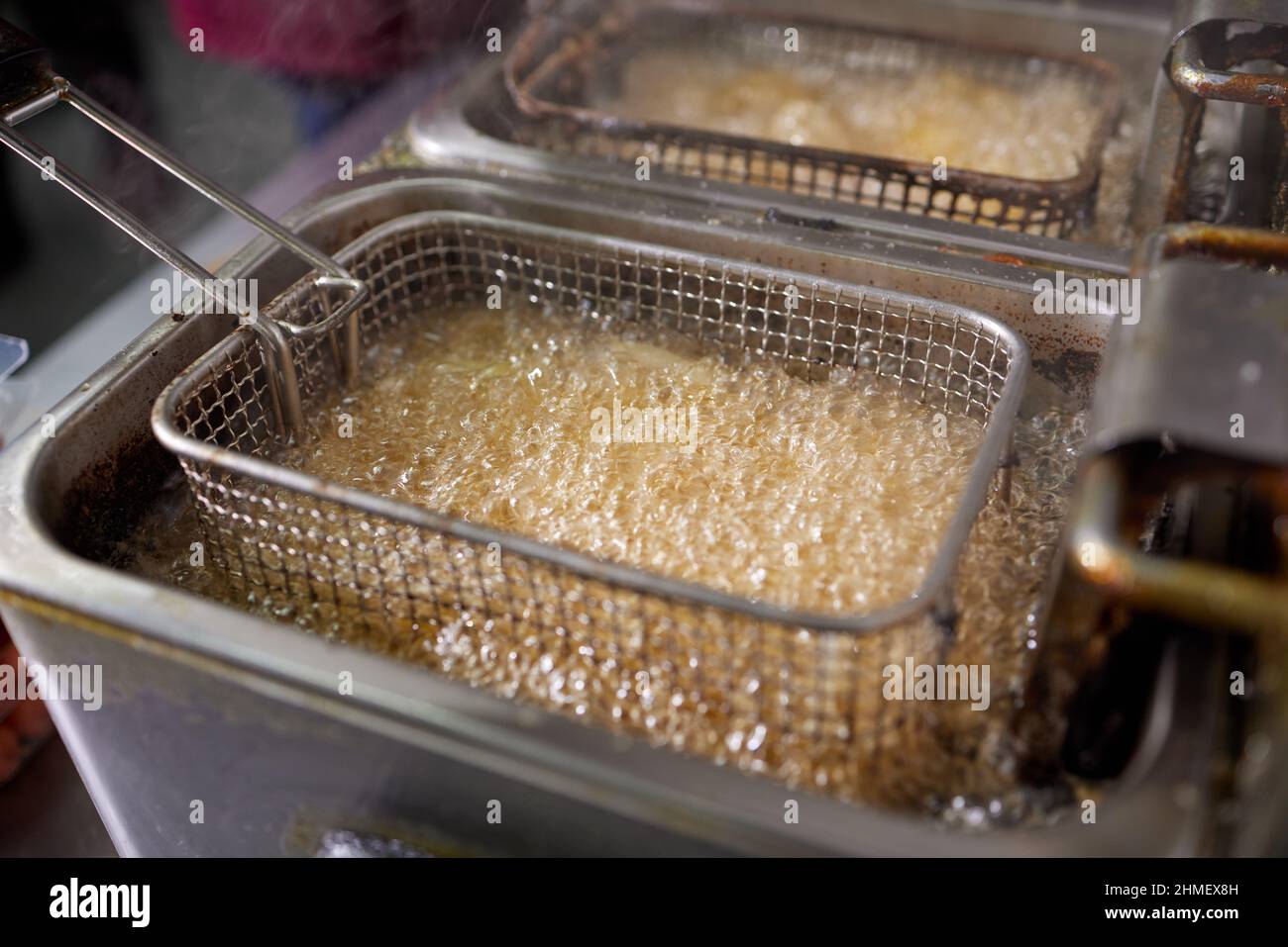 Dirty cooking area with french fries deep fryer Stock Photo - Alamy